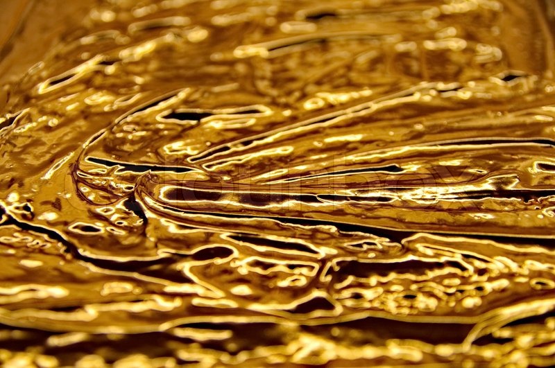 Flowing golden chocolate | Stock image | Colourbox