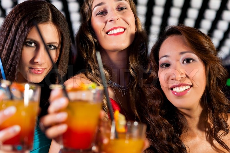 Group of party people with cocktails in ... | Stock image | Colourbox