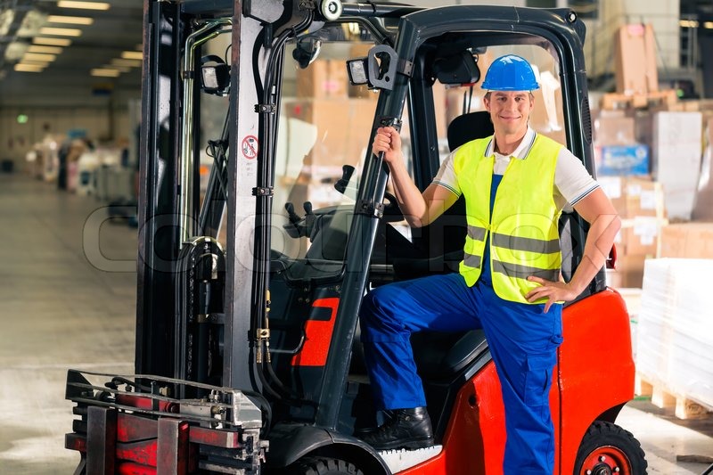 Forklift driver in protective vest and ... | Stock image | Colourbox