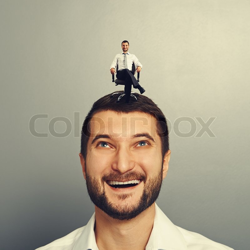 Happy man looking at small successful ... | Stock image | Colourbox