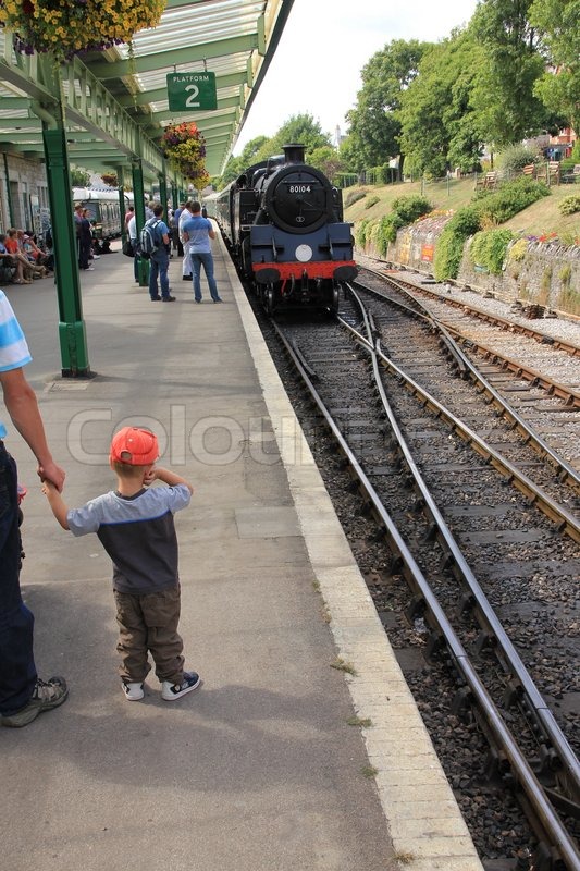 Holding hands on train station. | Stock image | Colourbox