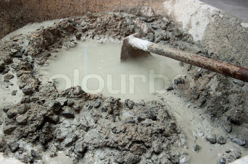 Spade and wet cement image for ... | Stock Photo | Colourbox