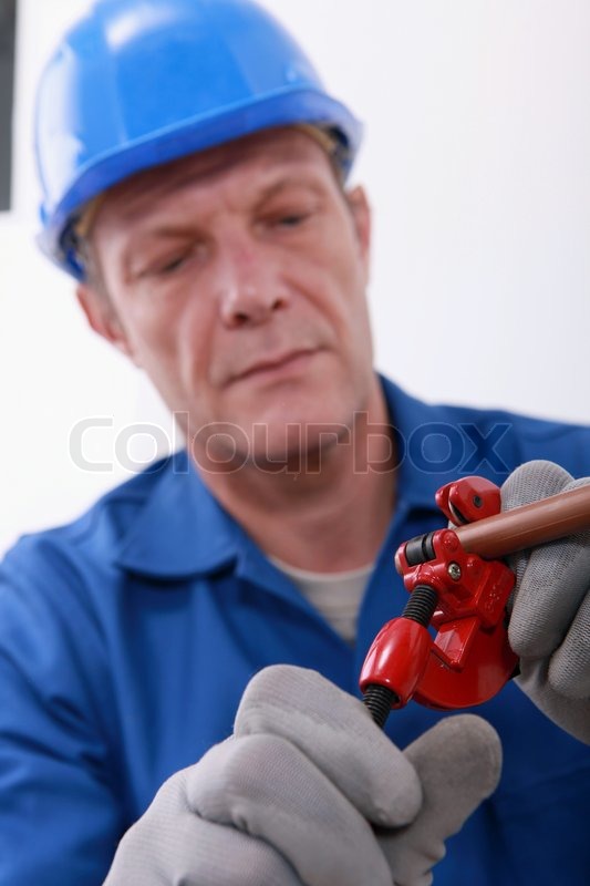Workers holding tube | Stock image | Colourbox