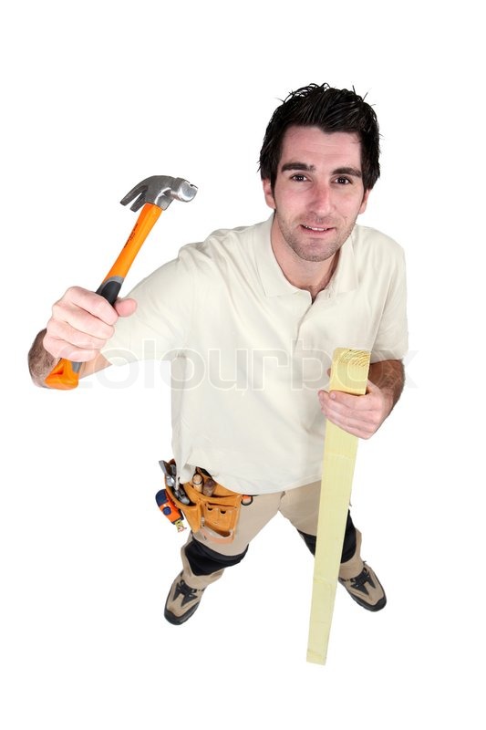 Handwerker mit einem Holzbrett und einem ... | Stock Bild | Colourbox