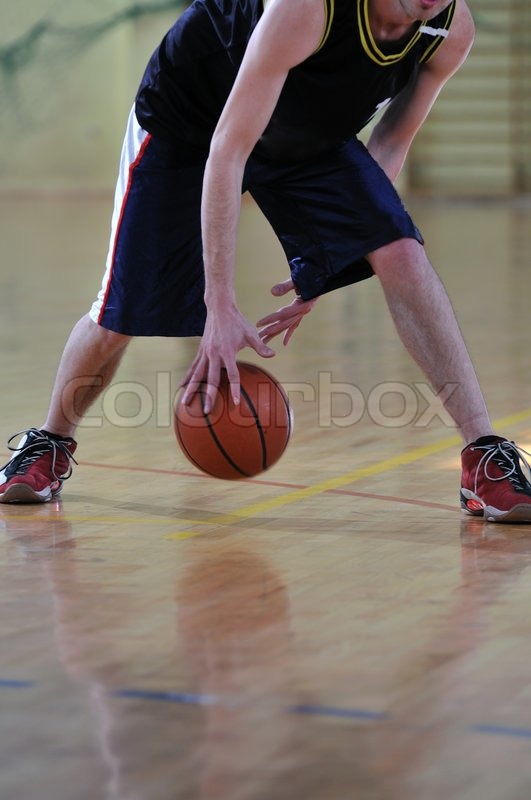 One healthy young man play basketball ... | Stock image | Colourbox