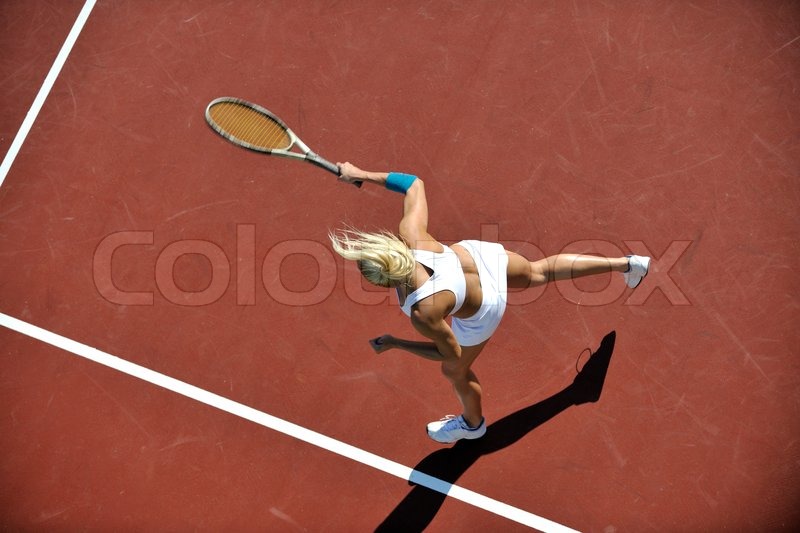 Young fit woman play tennis outdoor on ... | Stock image | Colourbox