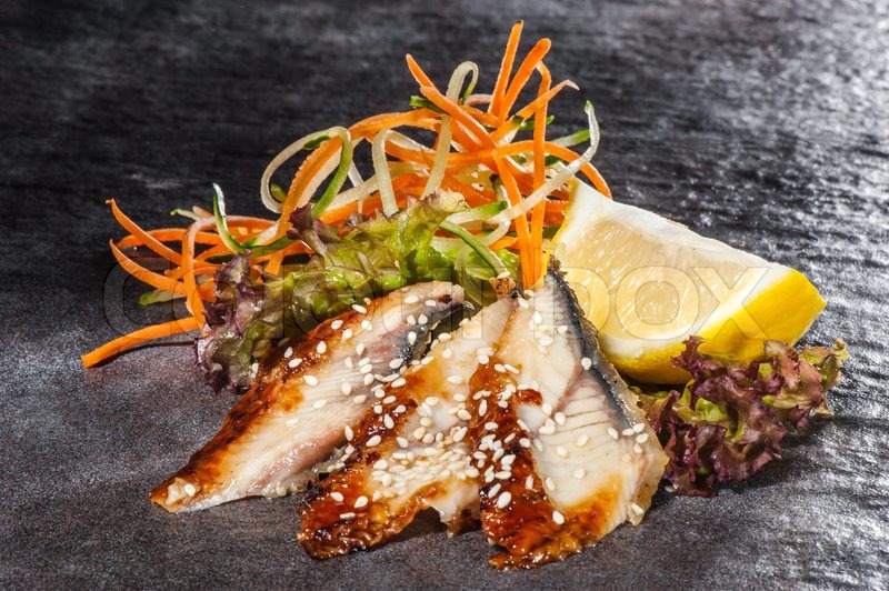 Fried eel slices with vegetable salad ... | Stock image | Colourbox