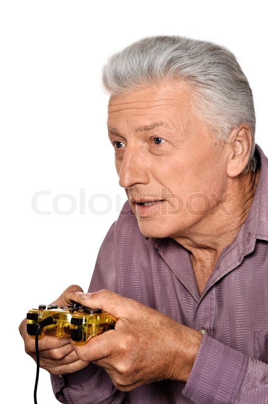 Happy Senior Man Plays Video Game | Stock image | Colourbox