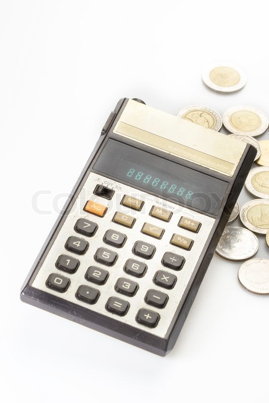 Old calculator and coins, isolated on ... | Stock image | Colourbox