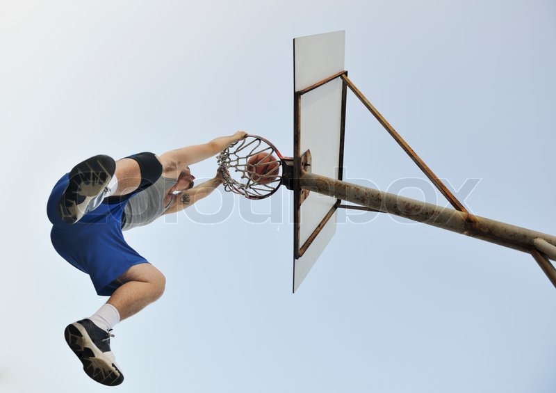 Basketball player practicing and posing ... | Stock image | Colourbox