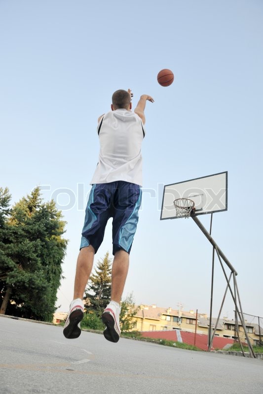 Basketball player practicing and posing ... | Stock Photo | Colourbox