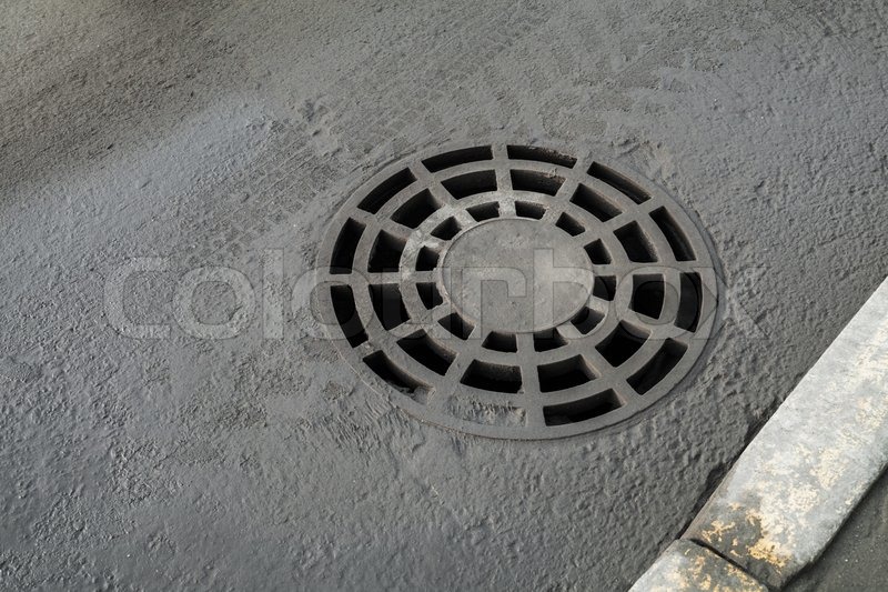Round drainage sewer manhole cover on ... | Stock image | Colourbox
