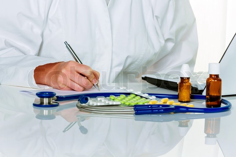 A young doctor prescribes medication. ... | Stock image | Colourbox