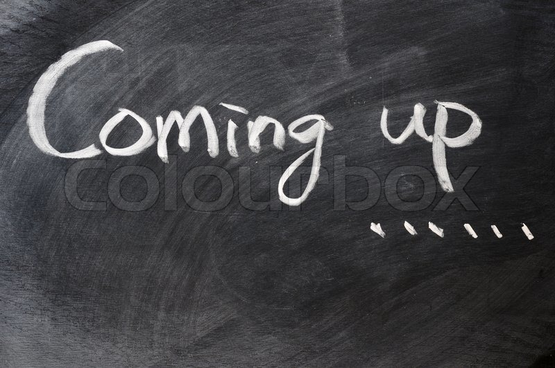 Coming up written on blackboard | Stock image | Colourbox