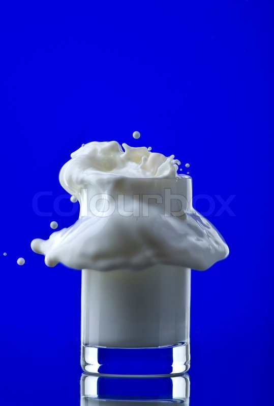 View of glass getting filled with milk ... | Stock image | Colourbox