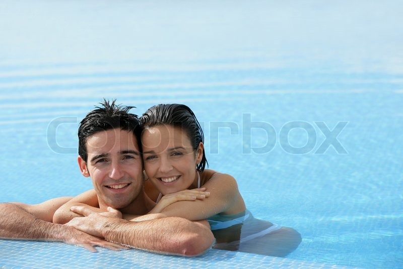 Affectionate couple in swimming pool | Stock image | Colourbox