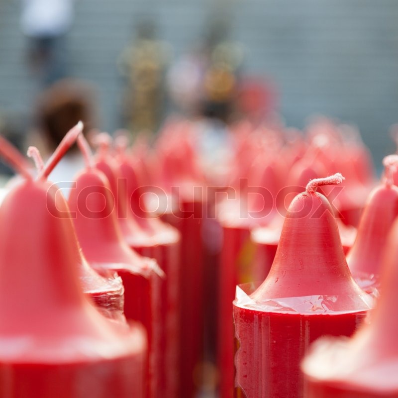 Big red candles lined up in a row a ... | Stock image | Colourbox