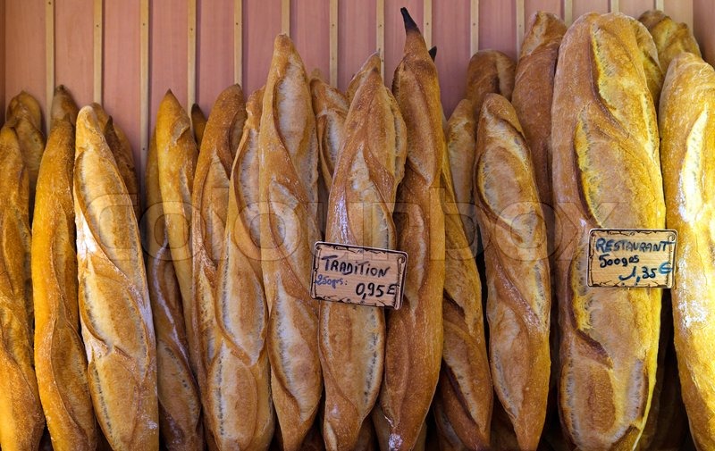 Fresh French bread in a wooden tray | Stock image | Colourbox