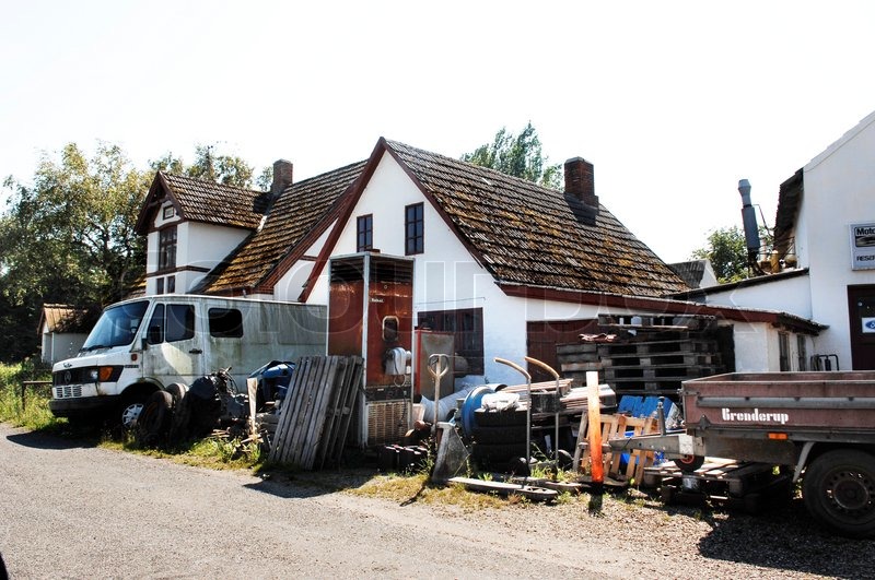 Junk collection in front of a house | Stock image | Colourbox