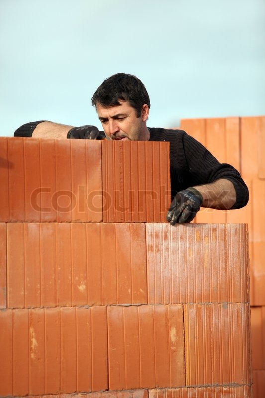Man building a house | Stock image | Colourbox