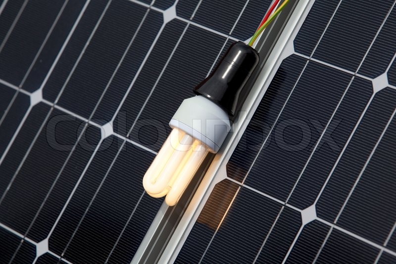 Energy saving light bulb on the solar ... | Stock image | Colourbox