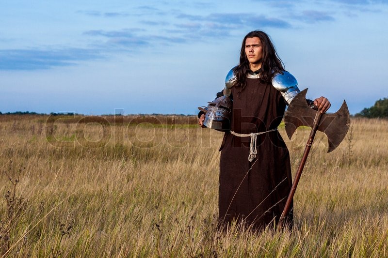 Medieval knight in the field with an ... | Stock image | Colourbox