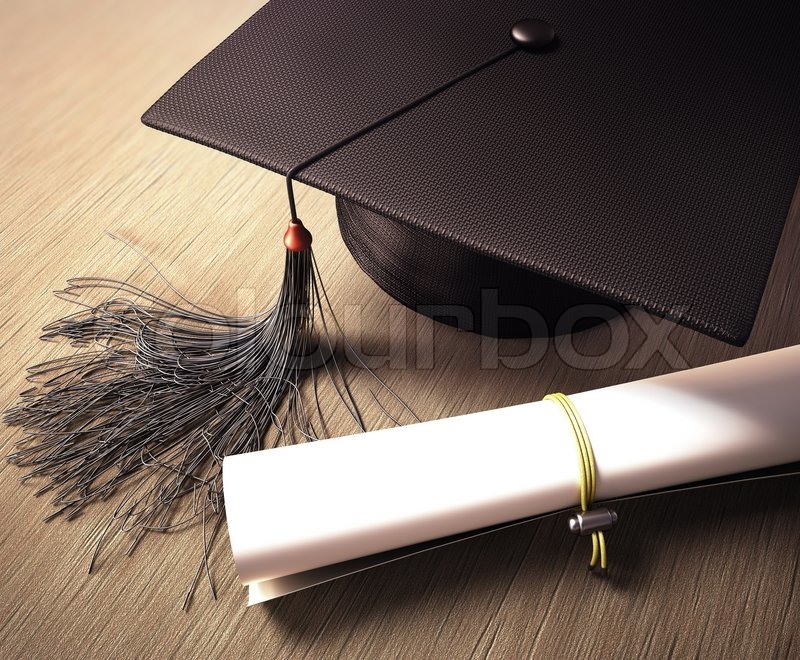 Graduation cap with diploma over the ... | Stock image | Colourbox