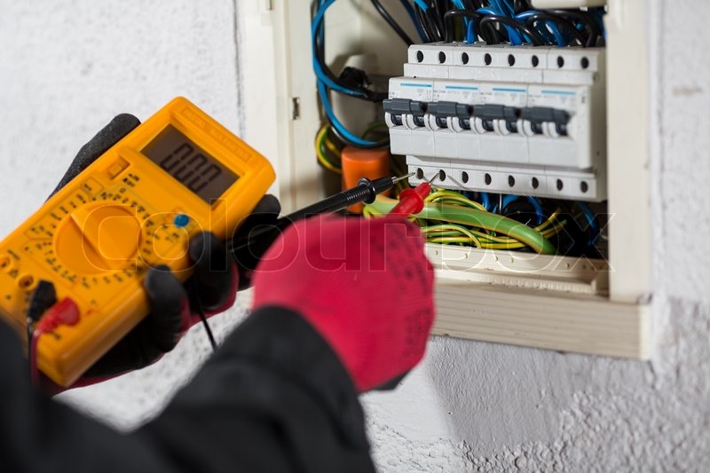 Electrician performing checks on a ... | Stock image | Colourbox