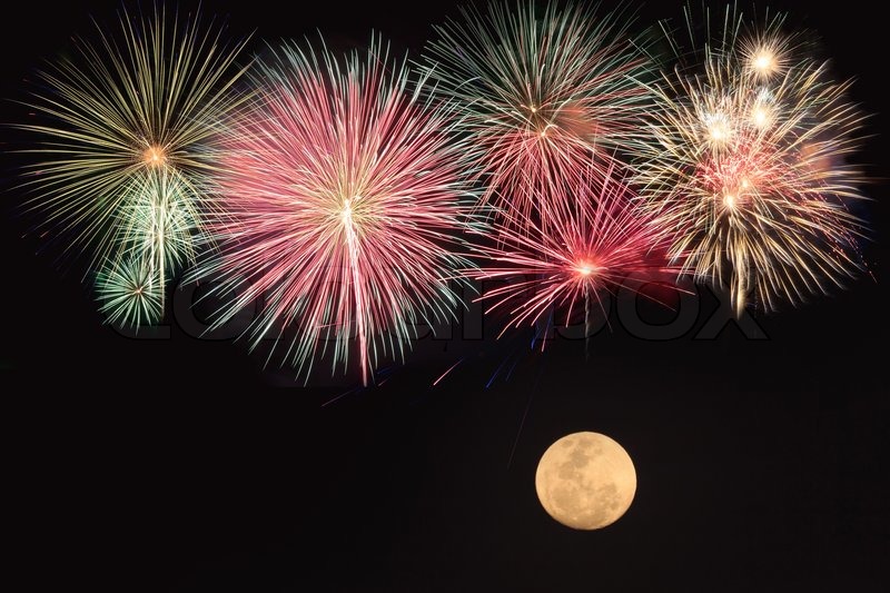 Colorful fireworks and full moon over ... | Stock image | Colourbox