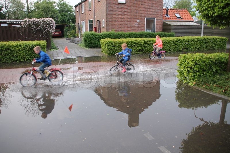 Flooding, the kids, two boys and a ... | Stock image | Colourbox