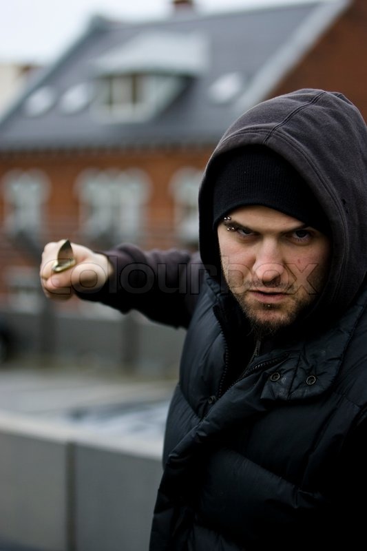 A male mugger with a knife | Stock image | Colourbox