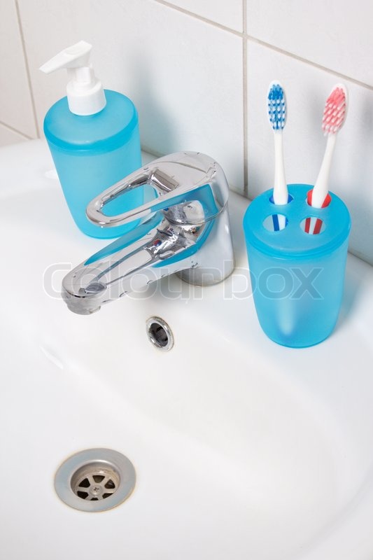 Close up of toothbrushes and soap on ... | Stock image | Colourbox