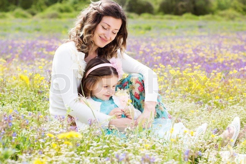 Little girl and her mother resting in ... | Stock image | Colourbox