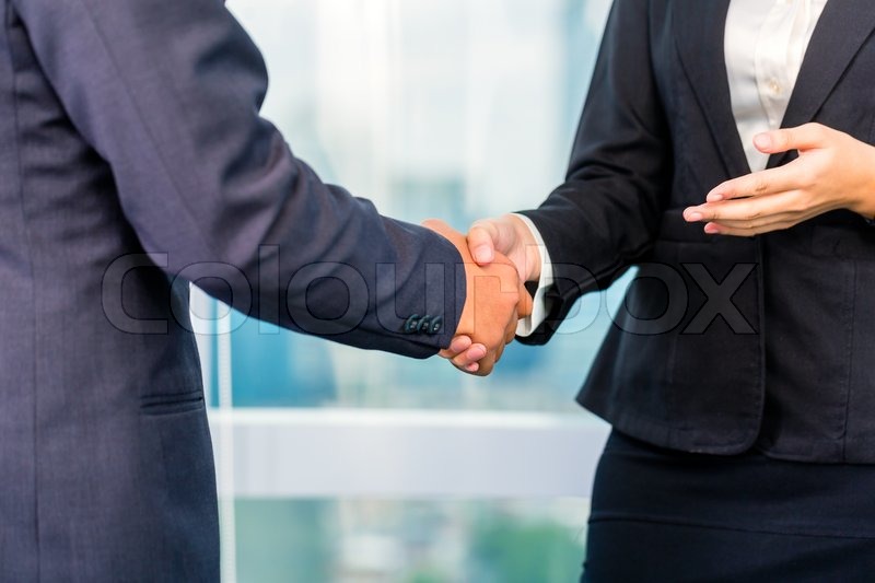 Close up of business people shaking ... | Stock image | Colourbox